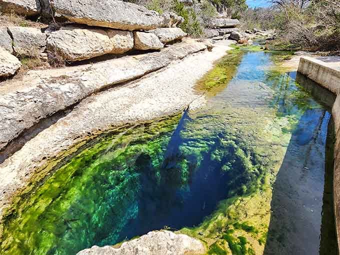 When Mother Nature decides to create art, she carves limestone channels that look like liquid sapphire pathways.