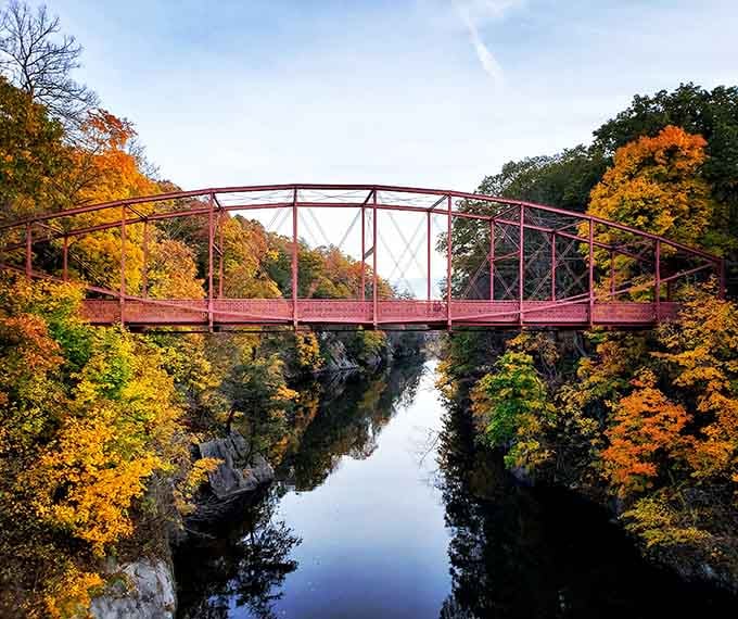 That historic iron bridge framed by fall foliage looks like something Bob Ross would paint during a particularly inspired episode.