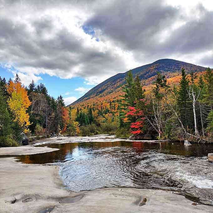 Fall foliage frames this rocky stream like Mother Nature's own masterpiece. The only traffic jam you'll find is leaves competing for attention.