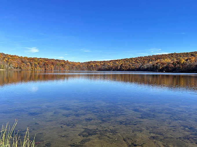Mirror, mirror on the lake! Shepherd Lake's glassy surface perfectly captures the Ramapo Mountains, creating nature's own Instagram filter without the need for hashtags.