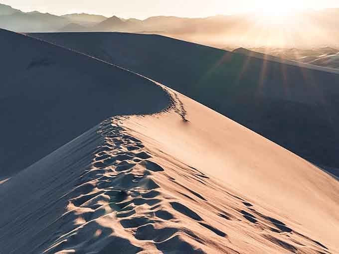 Those ridgeline shadows at sunset could make a minimalist weep with joy over nature's perfect geometry.