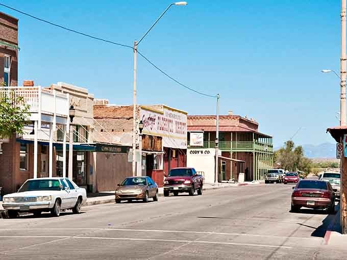 The architectural time capsule of Florence's historic district showcases colorful awnings and brick facades that have witnessed over a century of desert stories.