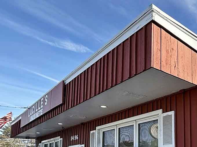 That rustic red exterior isn't trying to impress anyone, and that's exactly why it works so perfectly.