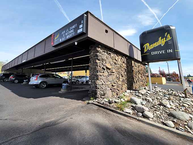 That stone pillar and vintage sign aren't just decoration, they're a promise that good things await under that canopy.