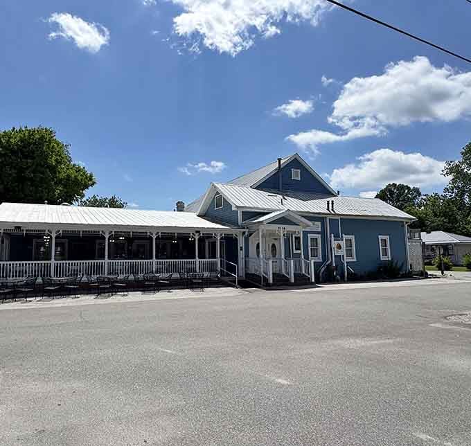 That charming blue building isn't just pretty to look at, it's hiding some seriously towering pies inside.