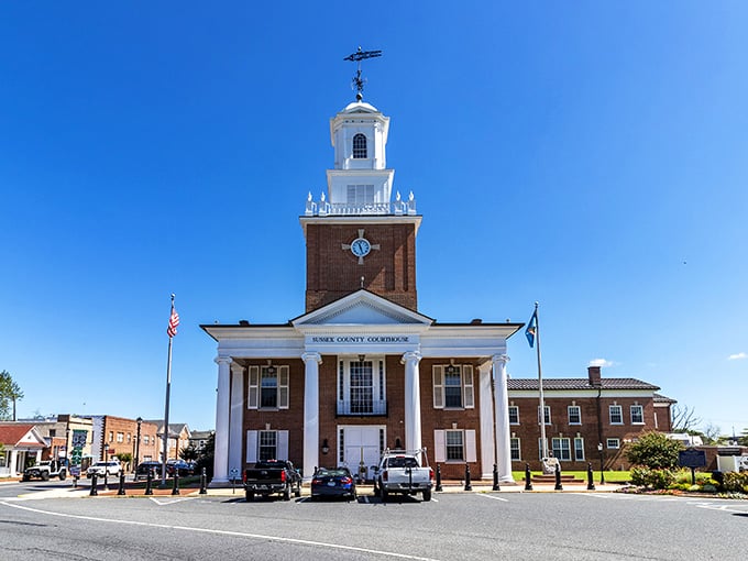 The Sussex County Courthouse stands proudly against a perfect blue sky, like Delaware's own mini-Capitol building with better parking options.