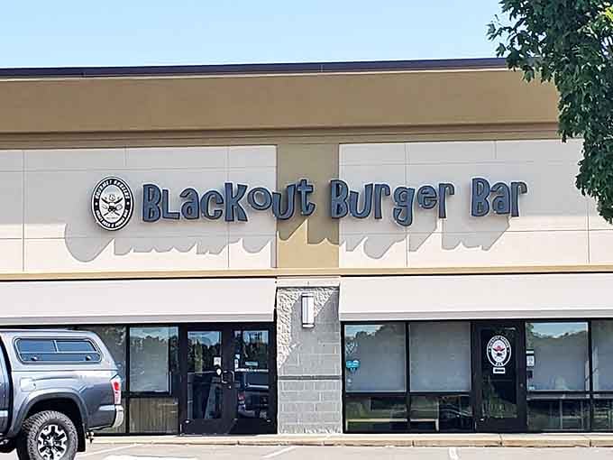 The unassuming exterior of Blackout Burger Bar hides culinary treasures within, like finding a diamond mine disguised as a hardware store.