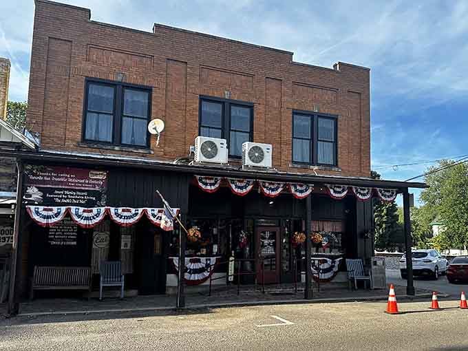 The patriotic bunting draped across the storefront tells you everything about this place's pride in community and country.