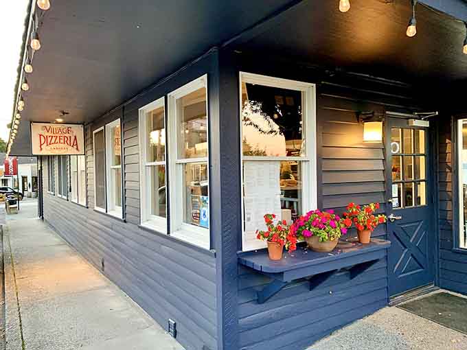 String lights and flower boxes signal you've arrived somewhere special, where pizza dreams become delicious reality.