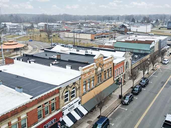 Winter's blanket softens the rooflines, turning Main Street into a snow globe you'd actually want to live inside.
