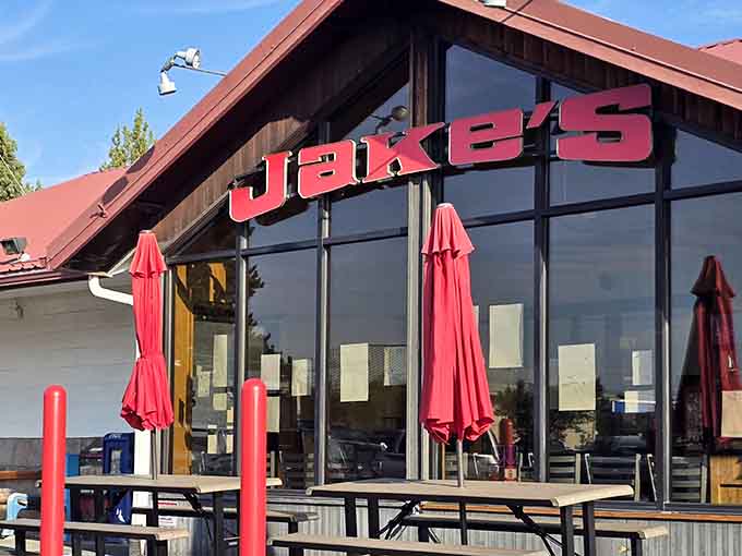 That bold red signage against the mountain sky tells you everything: breakfast paradise awaits inside Jake's Diner.