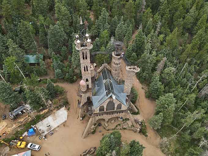 Stone archways frame mountain views, blending human creativity with nature's own spectacular backdrop perfectly.