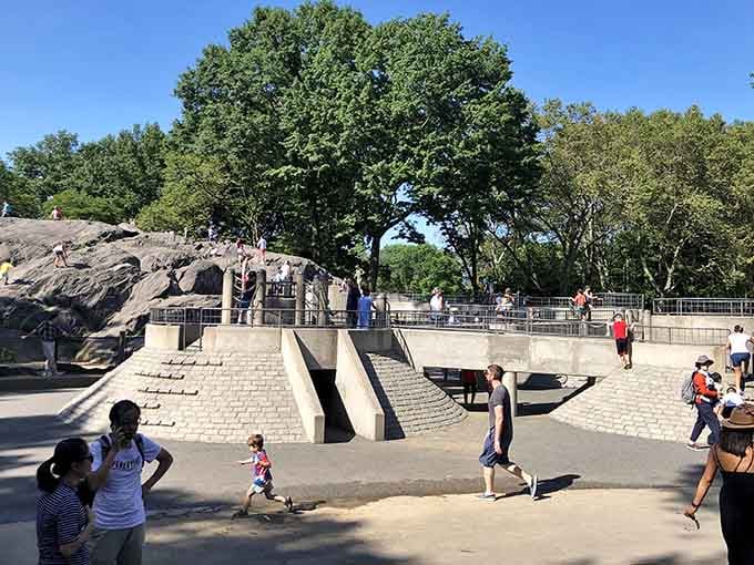 Kids dart across this architectural playground like they've discovered the world's coolest urban obstacle course in Central Park.