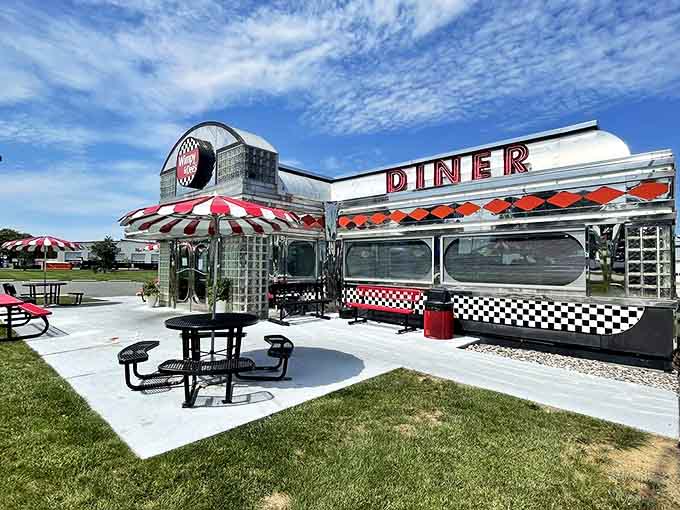 The gleaming chrome exterior of Wimpy & Dee's stands like a time machine in Honey Brook, its red-and-white awning fluttering in welcome beneath Pennsylvania's big sky.