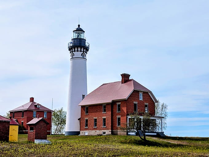 That white tower rising against Lake Superior's blue waters looks like it belongs on a movie set, not reality.