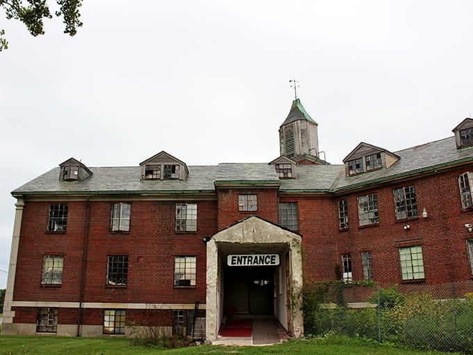 That imposing red brick facade isn't just for show, it's been collecting ghost stories since before your grandparents were born.