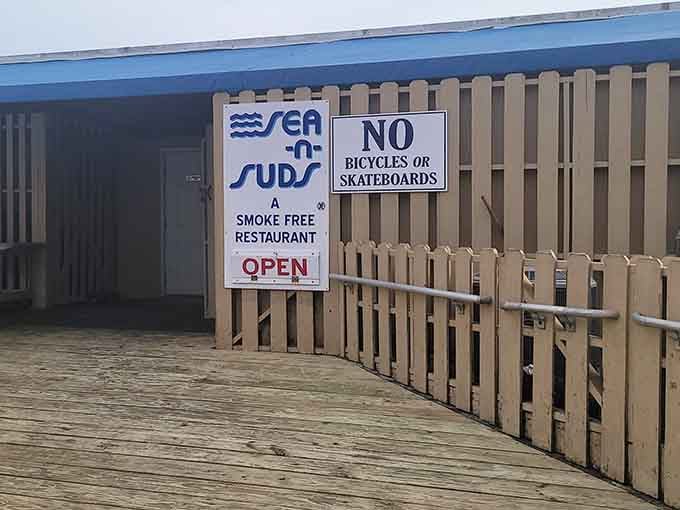 That weathered wooden boardwalk leading to Sea N Suds is basically your yellow brick road to seafood happiness.