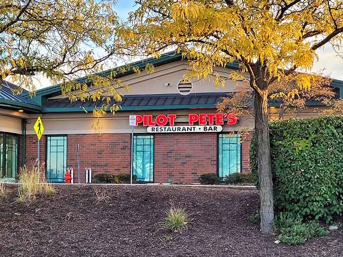The bright red sign beckons like a beacon for hungry aviation enthusiasts and curious suburbanites alike.