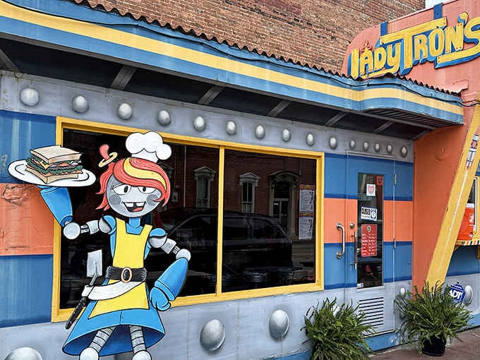 That cheerful robot mascot serving sandwiches outside proves New Albany takes its sci-fi lunch seriously.