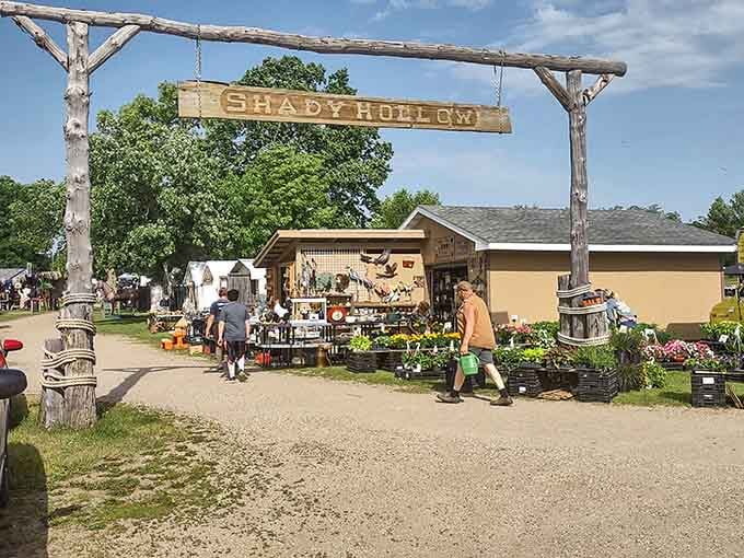 That rustic wooden entrance sign welcomes you to treasure-hunting paradise where bargains bloom like wildflowers in summer.