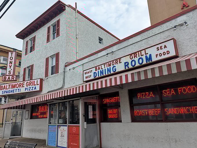 The red and white striped awning practically screams "real deal Italian food here" louder than any Sinatra song ever could.