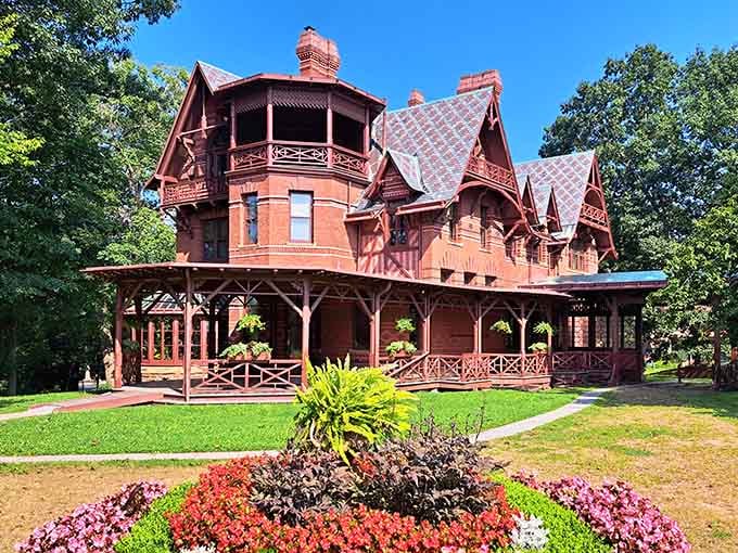 Those flower beds are working overtime to compete with the house's natural showstopping presence, bless their colorful hearts.