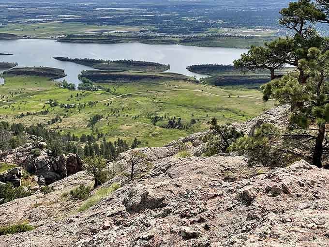 The view from Arthur's Rock summit reveals Horsetooth Reservoir's blue fingers reaching into the landscape—nature's version of a perfect jigsaw puzzle.