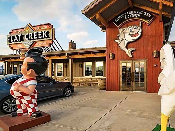 Visit Flat Creek for a nostalgic lakeside meal, featuring their famous fried chicken, catfish, and quirky, larger-than-life outdoor statues.