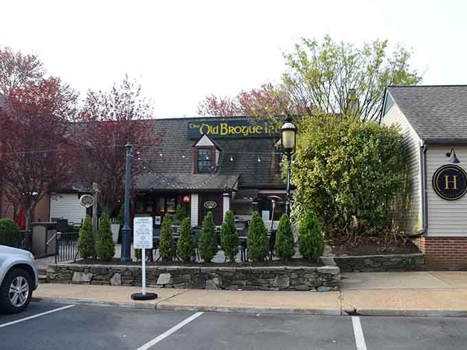 Stone walls and seasonal greenery frame this Irish pub like it's been here since the Mayflower took a wrong turn.