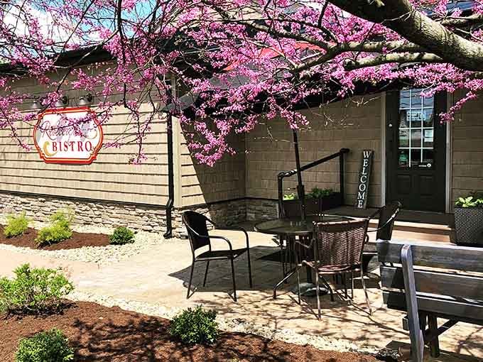 That elegant sign out front isn't just decoration; it's a promise of the culinary adventure waiting inside.