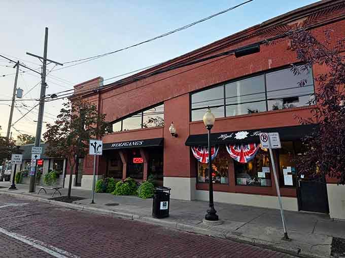 That brick facade and those patriotic bunting flags signal serious breakfast business happening inside this Grand Rapids treasure.