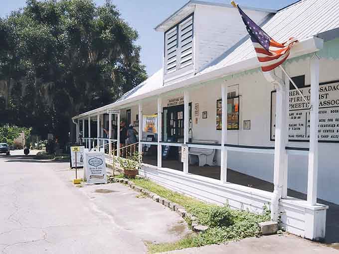 That classic white porch and American flag signal you've arrived somewhere refreshingly different from modern Florida.