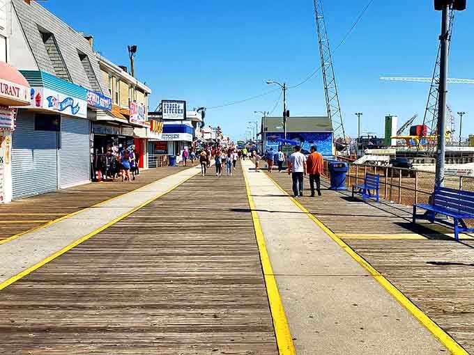 The boardwalk stretches endlessly, promising funnel cakes, questionable life choices, and memories you'll actually want to keep.