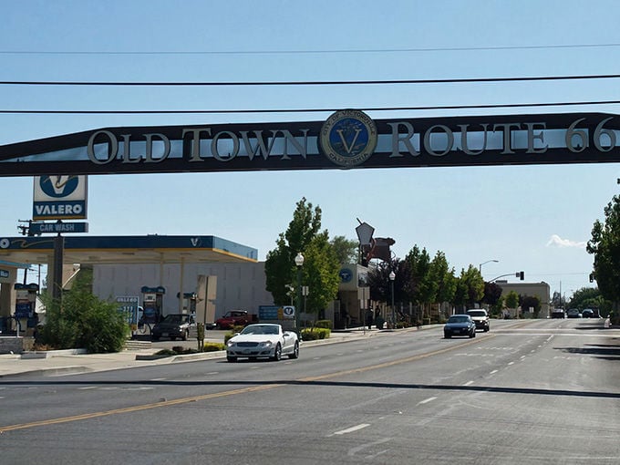 The Old Town Route 66 sign stands as a sentinel to Victorville's past, when road-trippers and dreamers first discovered this High Desert haven.