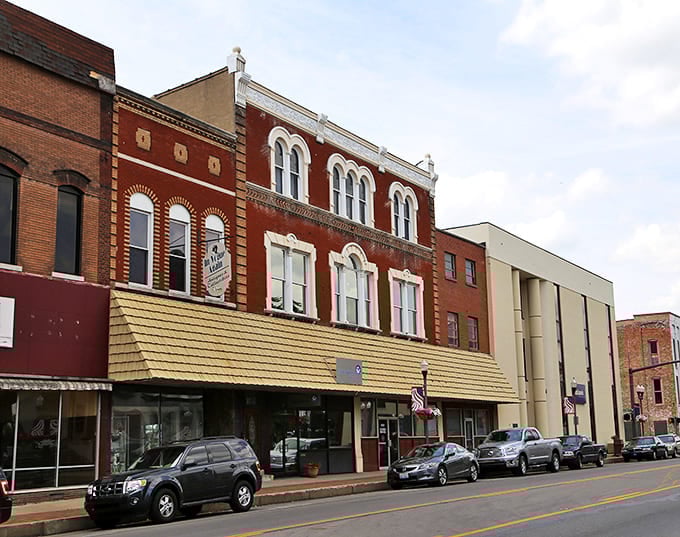 Historic brick facades line Madisonville's Main Street, where architectural character meets small-town charm without big-city price tags.