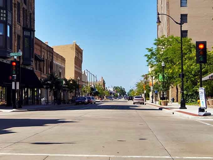 Sunlight bathes Oshkosh's downtown district, where traffic lights exist but road rage doesn't &ndash; a mathematical impossibility in larger cities.