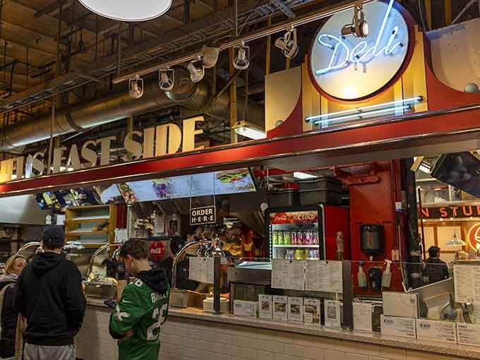 That glowing neon "Deli" sign beckons like a lighthouse guiding hungry ships safely to shore and spectacular sandwiches.