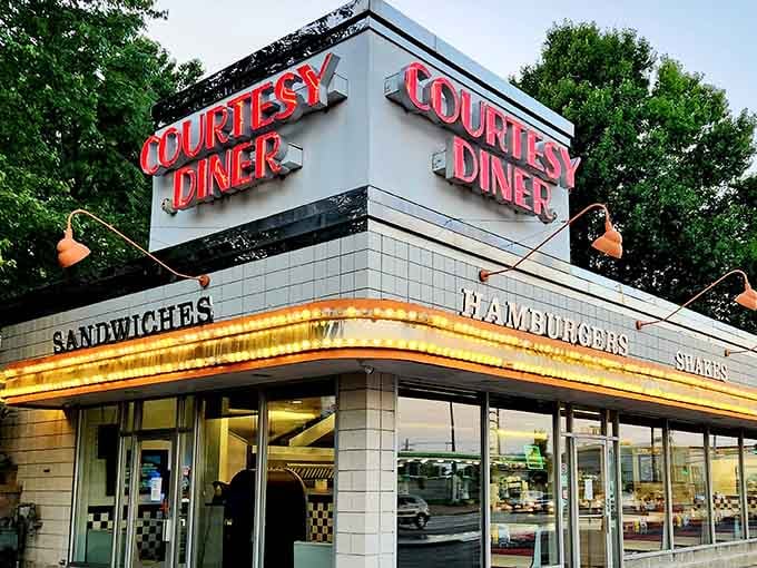 The neon-lit beacon of breakfast dreams! Courtesy Diner's iconic signage has guided hungry St. Louisans through morning fog and midnight cravings for generations.