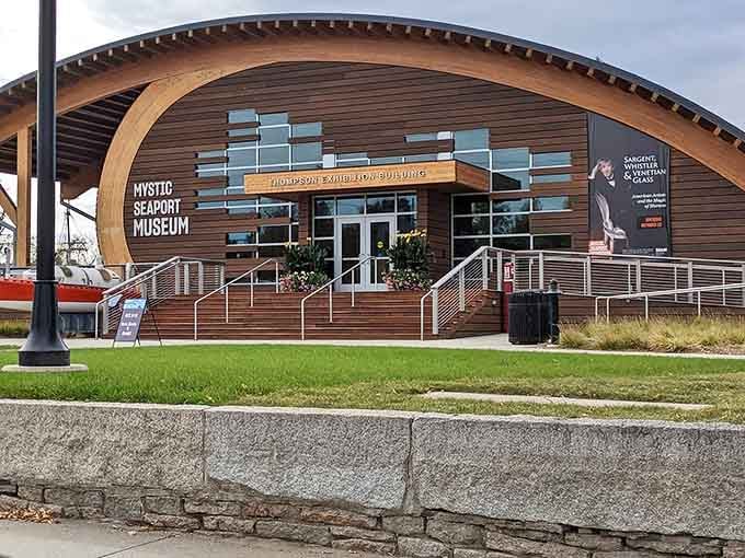 The contemporary exhibition building stands proud with its distinctive curved roofline, blending innovation with coastal heritage beautifully.