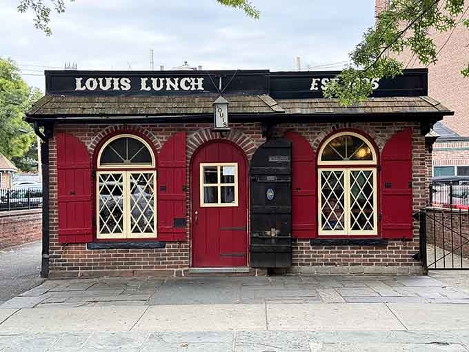 That charming red brick exterior isn't just for show; it's where American burger history literally began cooking.