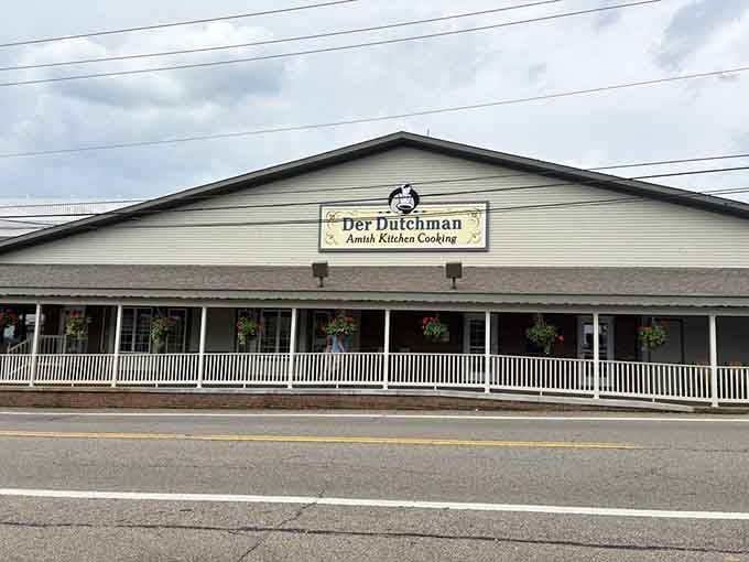 That welcoming front porch stretches like an invitation you can't refuse, promising comfort food and good times ahead.