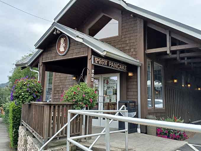 The wood-shingled exterior promises comfort food within, surrounded by coastal greenery that says "Oregon" without saying a word.