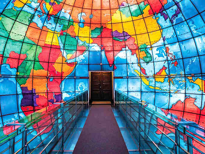 Step inside the world, literally, where 608 stained-glass panels create a glowing geographical masterpiece you'll never forget.