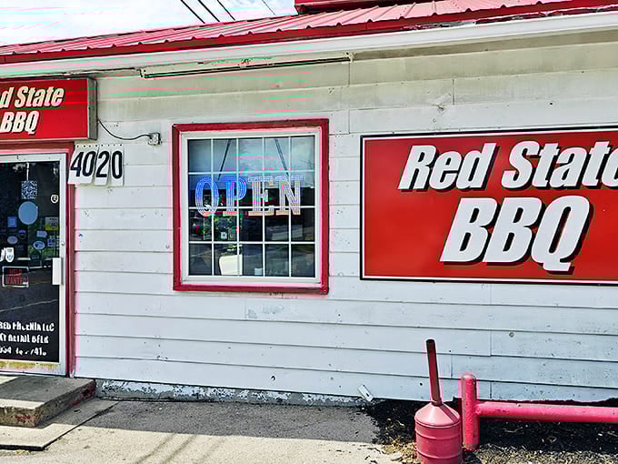 The unassuming exterior of Red State BBQ proves once again that the best barbecue joints often hide behind the simplest facades. Smoke signals of deliciousness await inside.