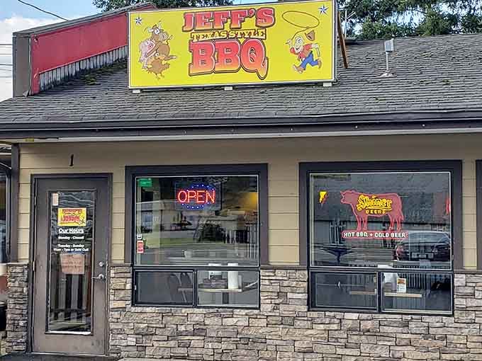 That cheerful yellow sign against Washington's evergreens is like finding a gold nugget in a stream – Texas BBQ treasure hiding in plain sight.