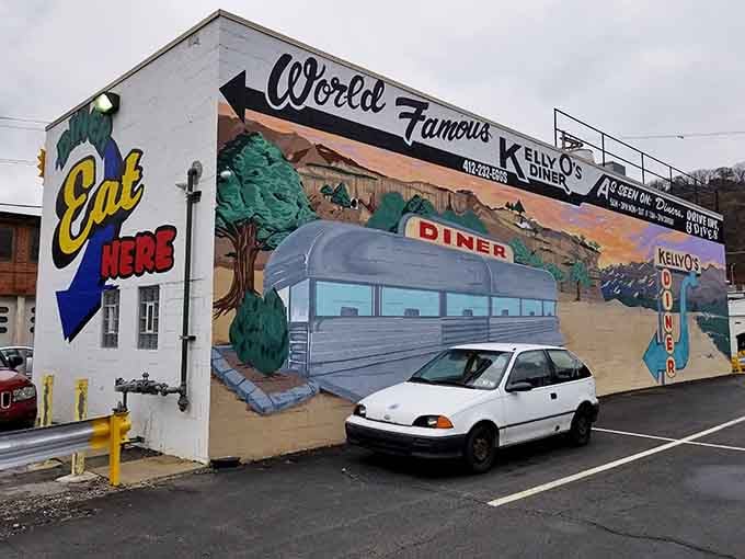 The mural transforms an entire wall into a vintage postcard, declaring this spot "World Famous" with well-earned confidence.