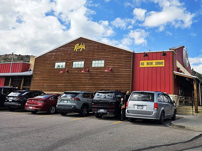 The iconic red exterior of Rudy's beckons like a barbecue lighthouse, promising smoky treasures within those rustic wooden walls.