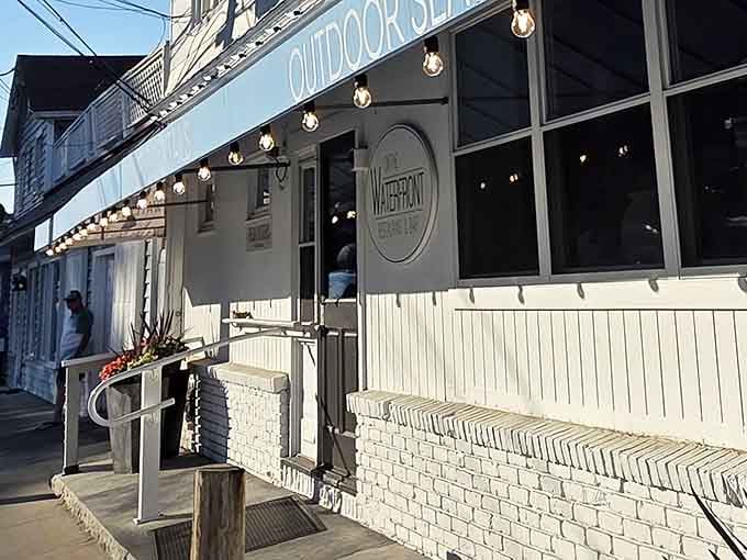 String lights and "OUTDOOR SEATING" signage&mdash;the universal language for "come relax here and forget about cooking tonight."