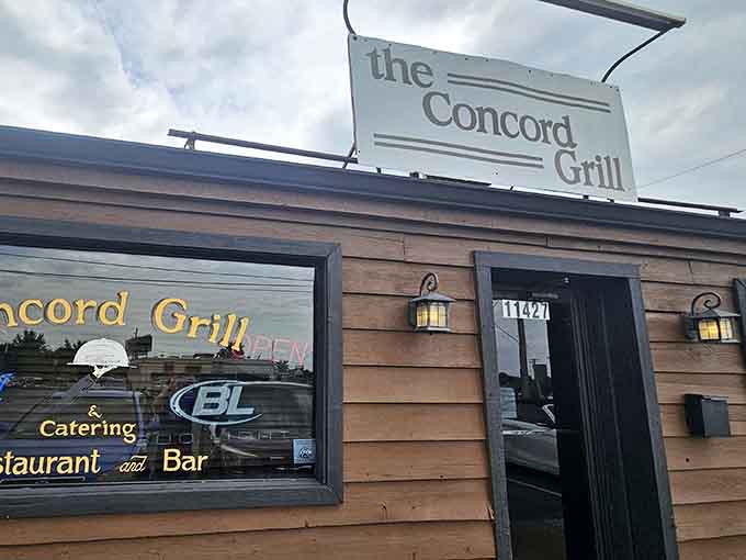 Rustic wooden siding and warm lantern lighting create that "come on in" vibe that neighborhood gems perfect over decades of serving hungry locals.