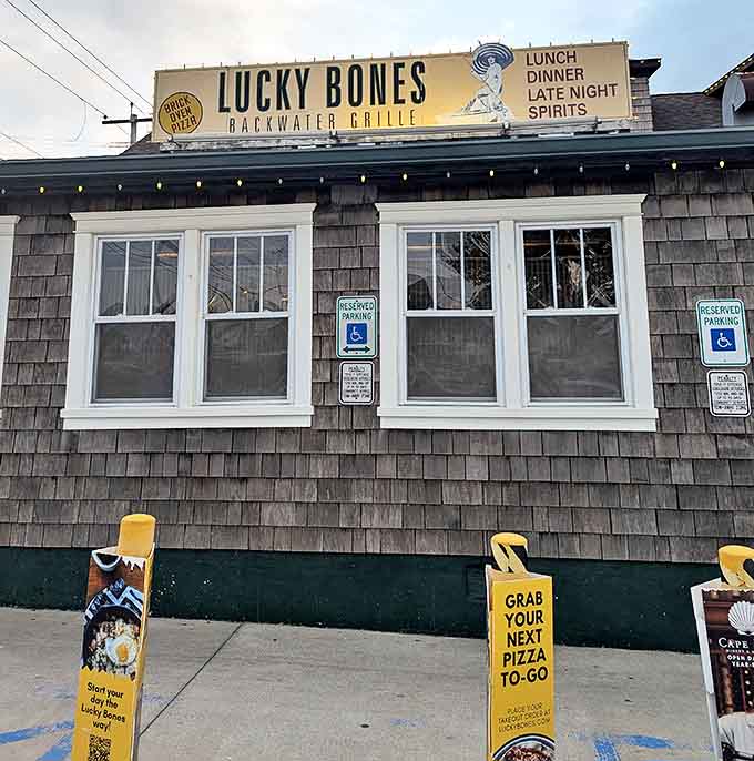 The weathered shingle siding and green trim of Lucky Bones whispers "come on in" like an old friend who knows all the best fishing spots in Cape May.